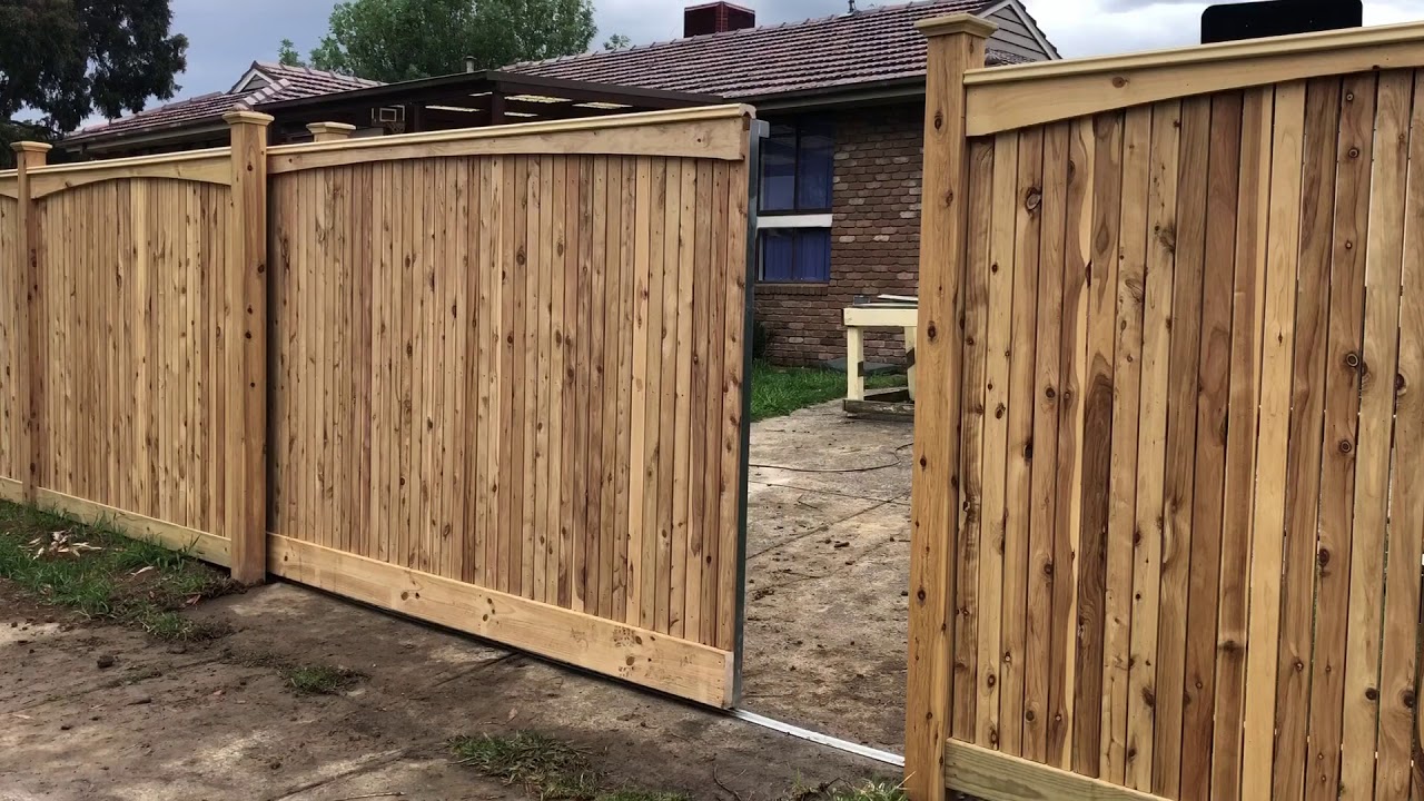 Feature fences with automatic sliding gates by Nailed it Fencing