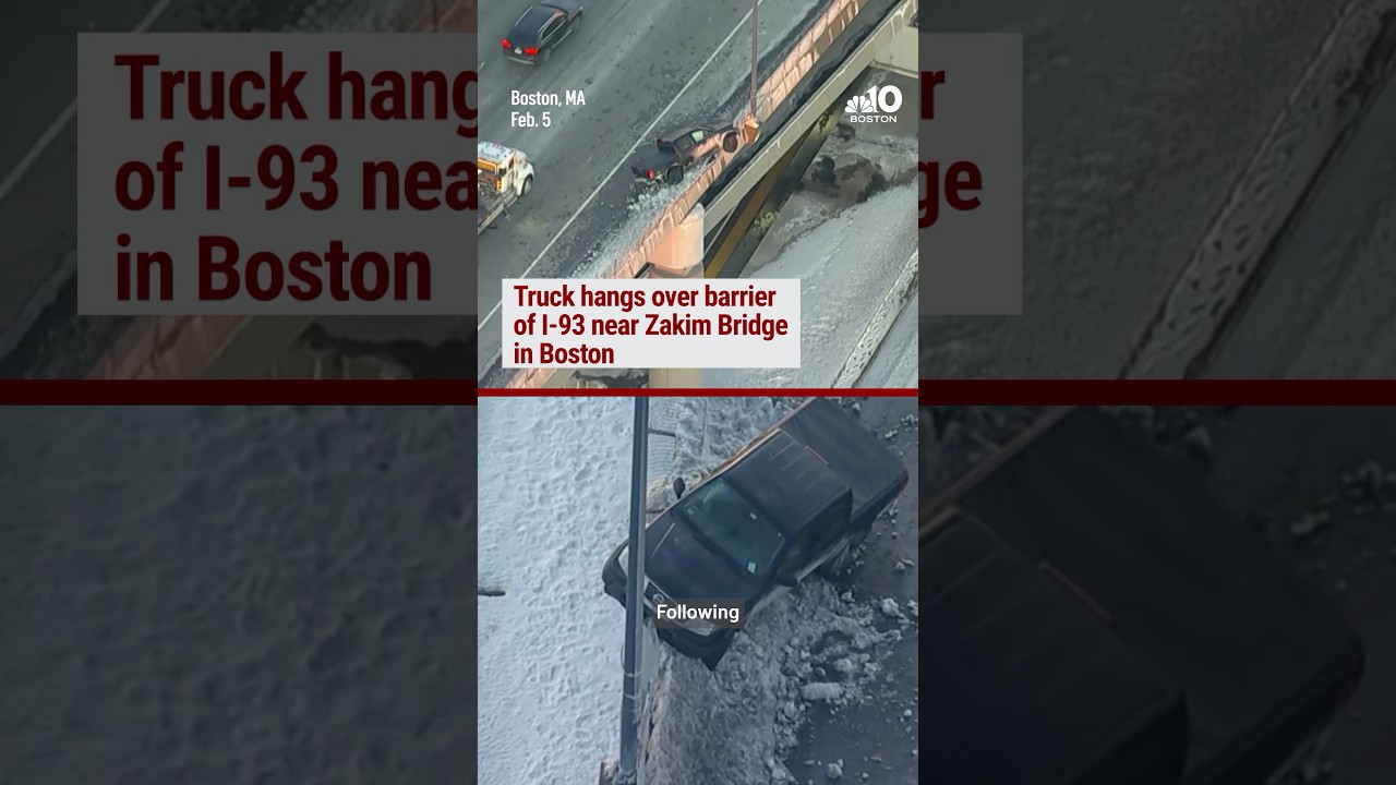 Truck hangs over barrier of I-93 near Zakim Bridge in Boston