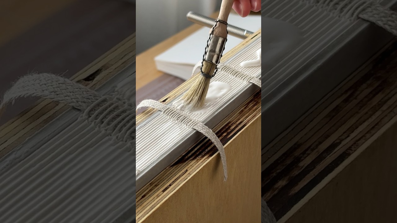 Rounded spine bookbinding process