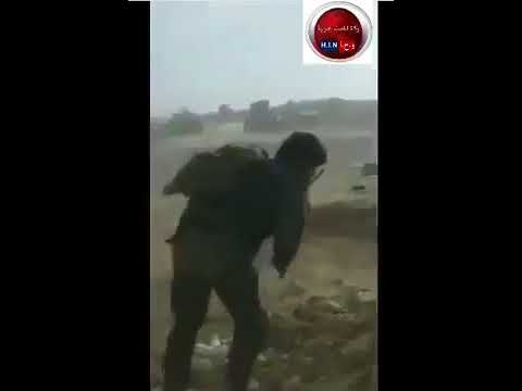 The moment of killing the pig Abu Ezraal Peshmerga hand this Peshmerga to an American or alliance
