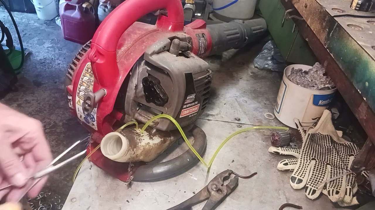 How to put a new carburetor and gas line on Craftsman leaf blower 25cc motor 200 mph 430cfm