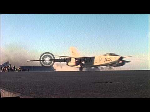 Aircraft take off and crew men on deck of USS Coral Sea underway in the South Chi...HD Stock Footage