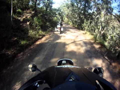 A fat bloke on a KTM 640 Adventure riding Settlers Rd Mogo Creek