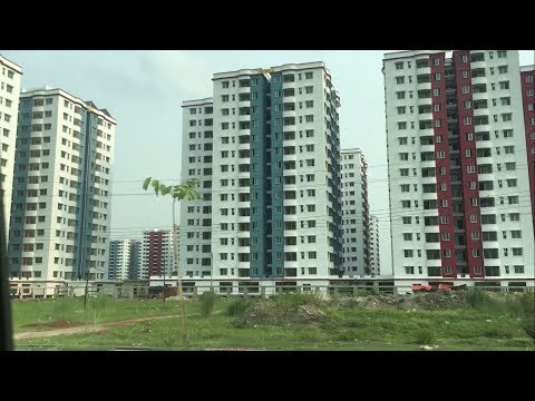 Large Green Open Area and RAJUK Uttara Apartment Project Buildings