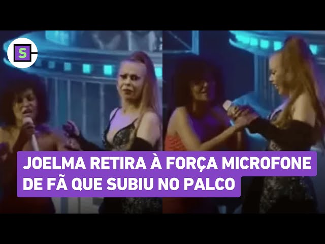 Joelma retira à força microfone de fã após ser criticada no palco