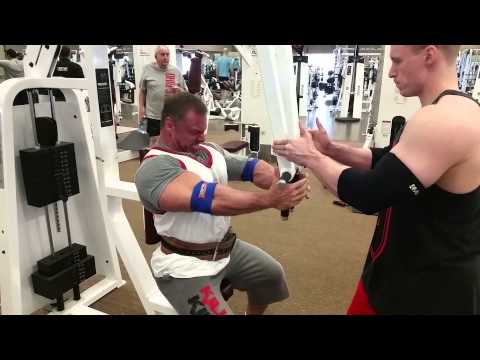 Machine flye with forced reps, iso hold, and partials.
