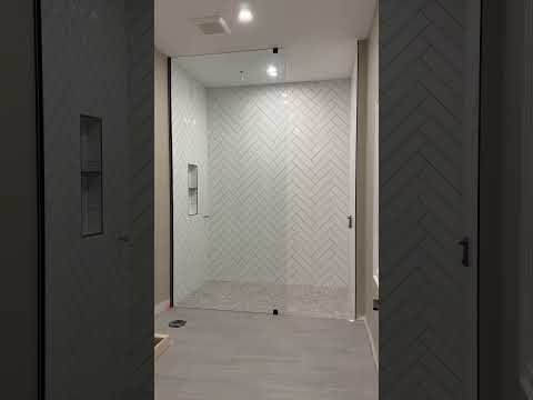 Massive custom glass panel 57” by 118” for walk in shower.