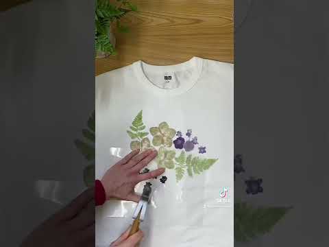 Eco print on a t-shirt. Hammered flowers