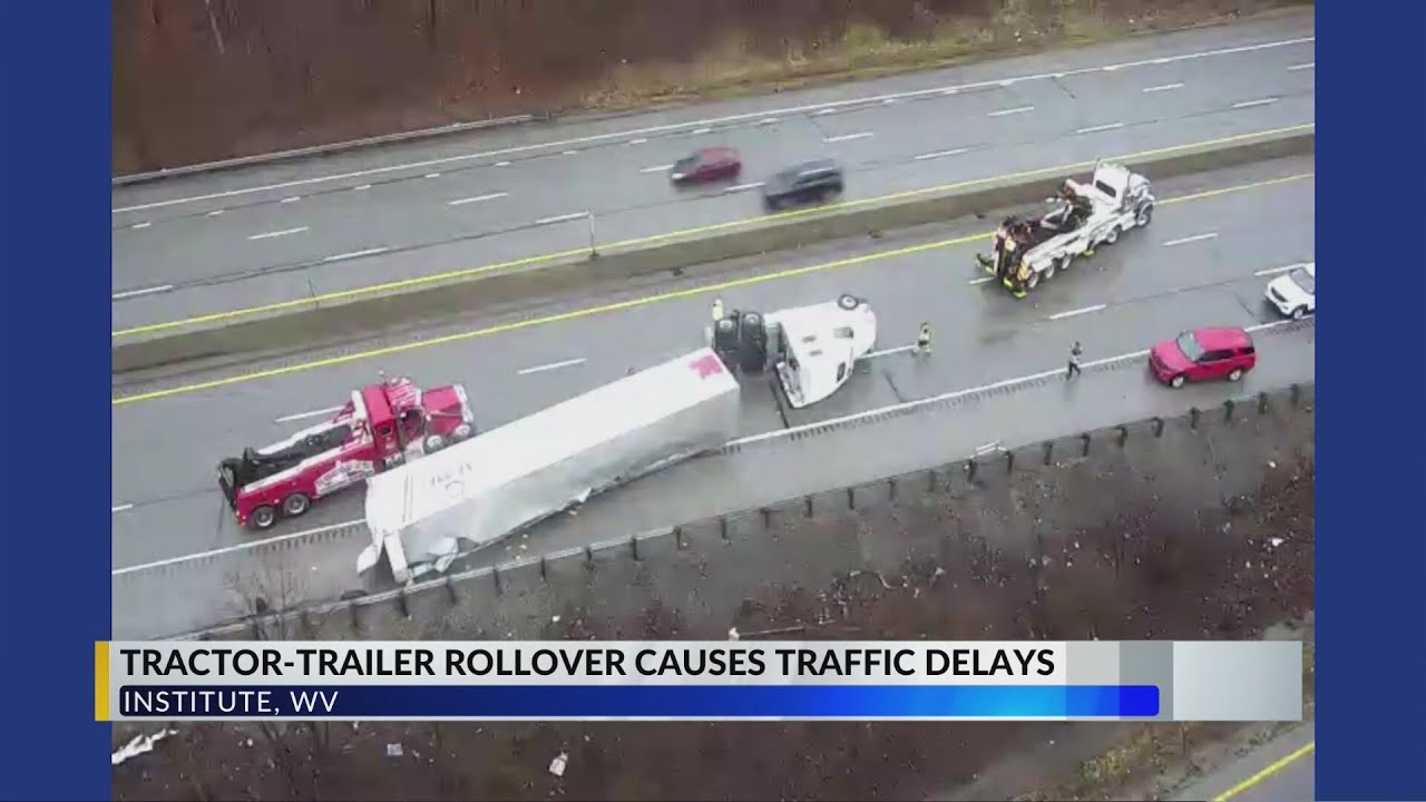 I-64 lanes closed after tractor-trailer rolls over near Institute