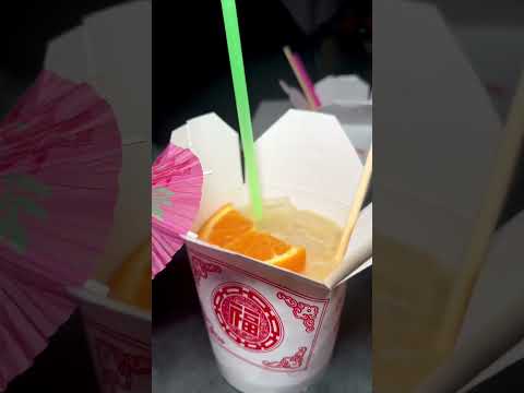 A cocktail served in a Chinese food box 🥡