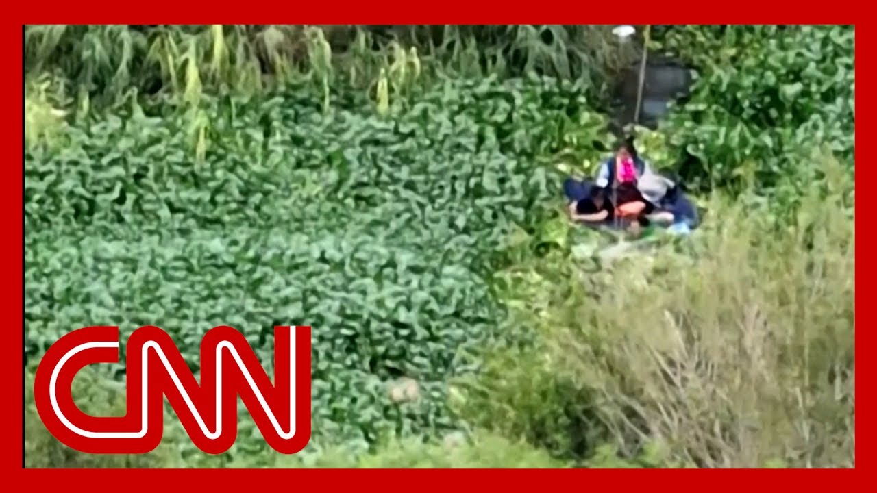 US border officials watch migrants use rafts to cross into US