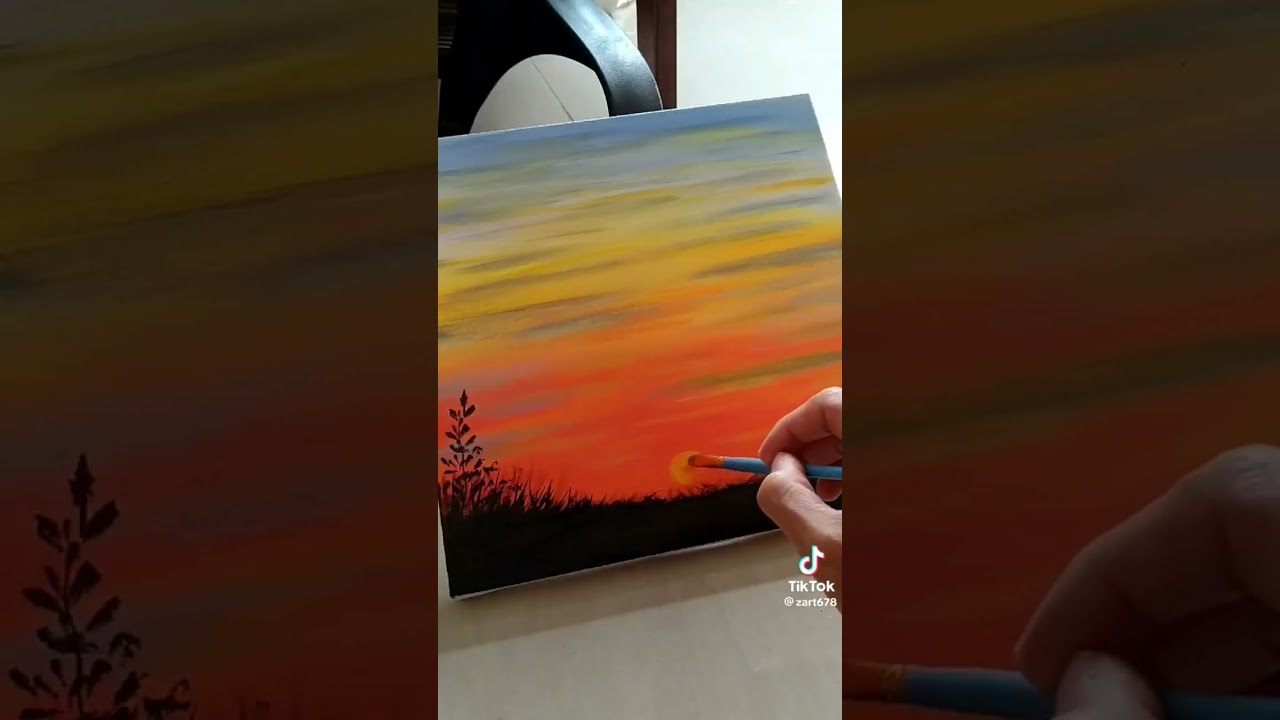 melukis pemandangan di waktu senja.