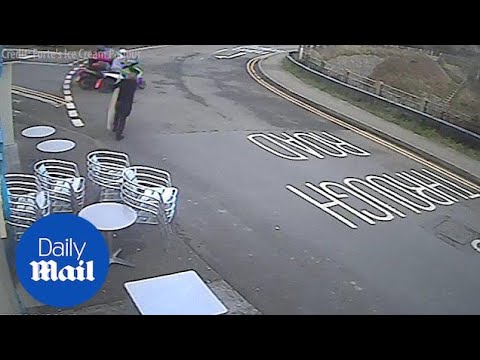 Motorbike thief is taken to the ground by the vehicle's owner - Daily Mail