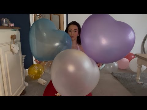 Blowing up heart shaped themed balloons for Valentine’s Day