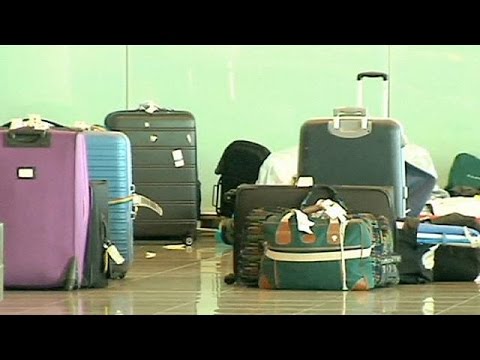 Thousands of Vueling passengers' suitcases piled up in Barcelona's El Prat airport.