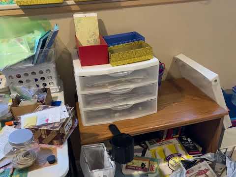 Organizing my scrapbook paper and adding scraps to my storage drawers.