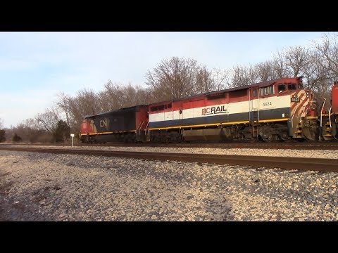 1/19/18 - CN 2439 and BCOL 4624, two C40-8Ms, lead CN M396 at Centralia, IL