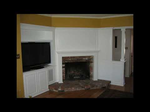 Built in white entertainment center cabinets and wall units
