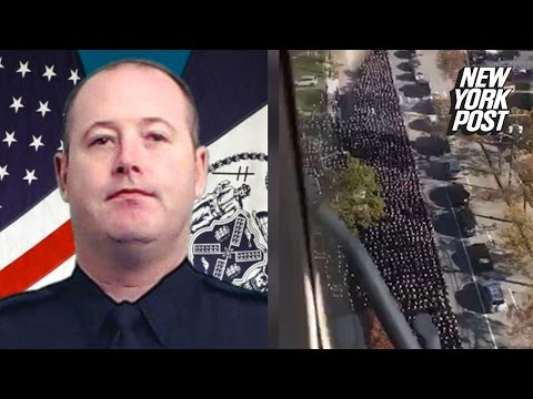 Thousands of cops line streets in an emotional salute
