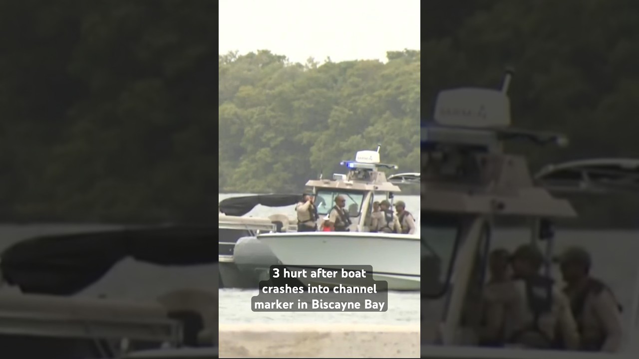 Three people were hospitalized after a boat crashed into a channel marker on Biscayne Bay.