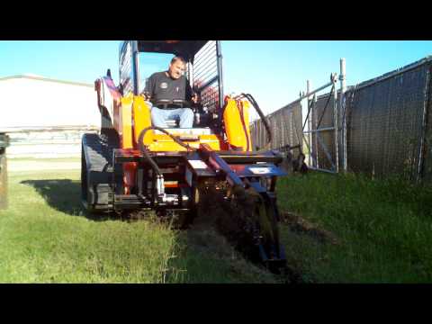 Kubota SVL90 with trencher
