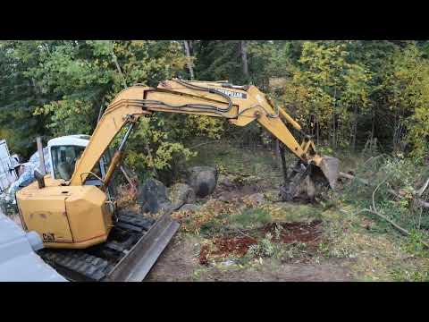 Levelling beside a shop for a storage trailer