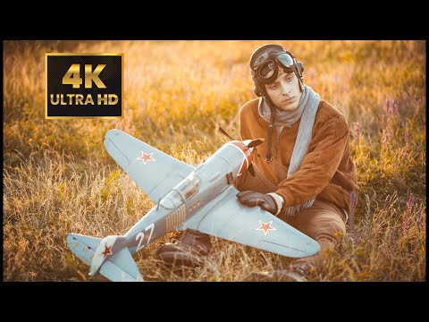 Man Holding Vintage Plane 4K Video Screensaver Wallpaper for Tv