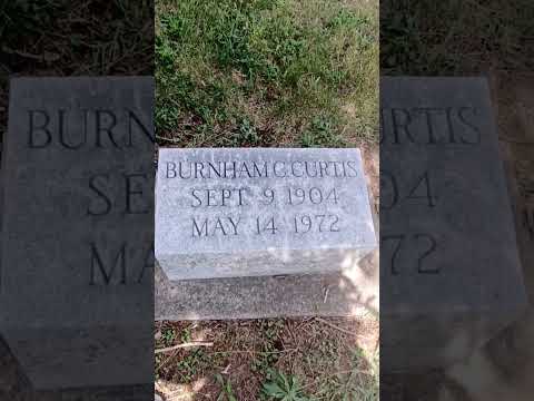 family of 4 burial plot in a row gravestones in cemetery