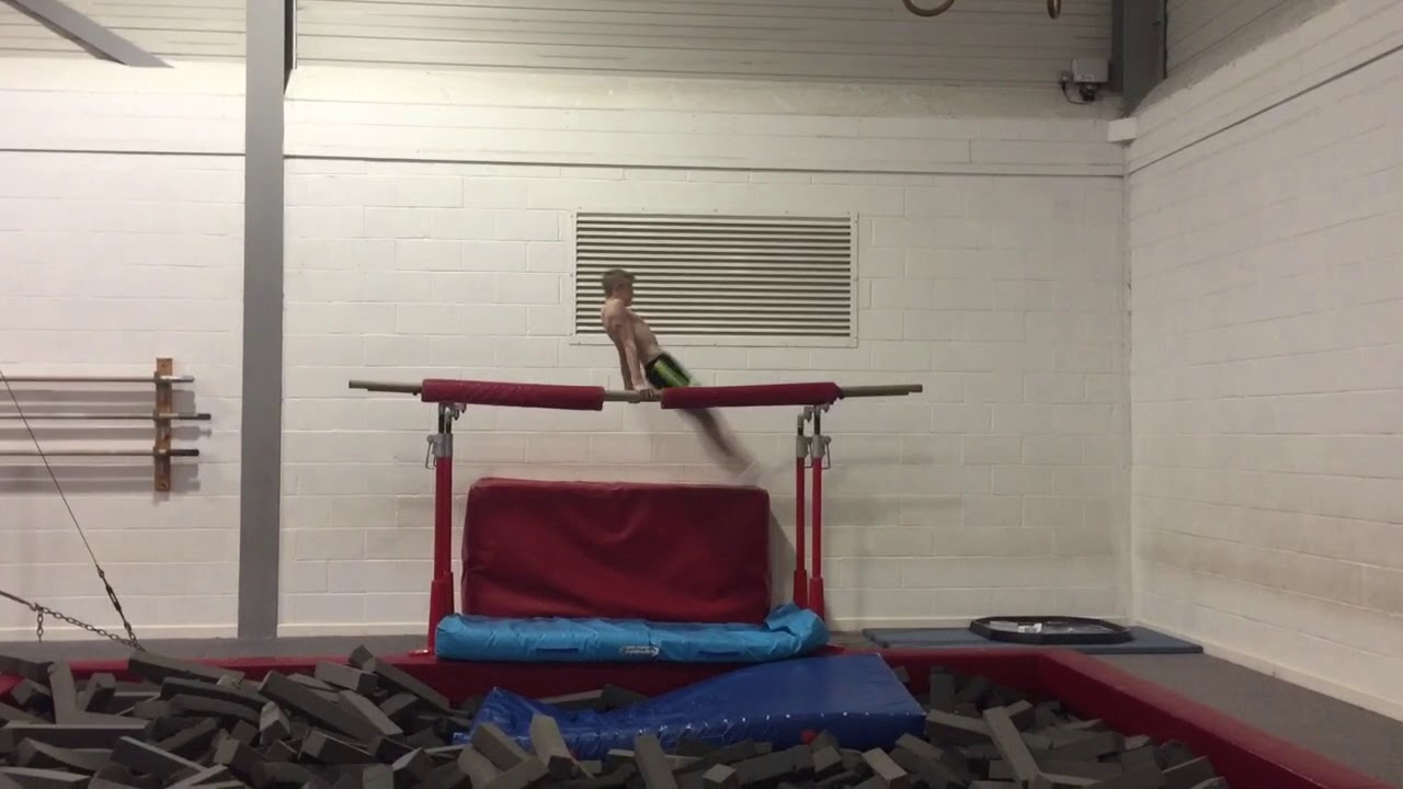 Double front parallel bar dismount into pit