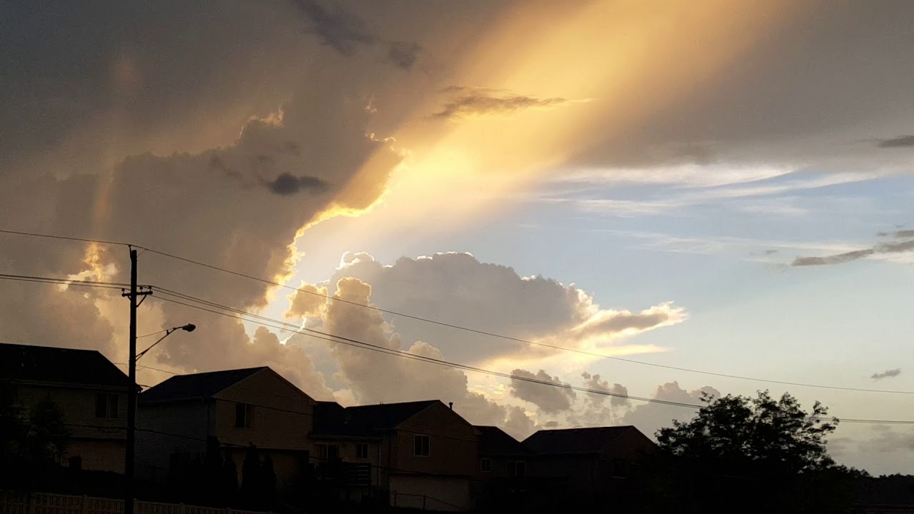 Sun Shining Through Clouds After Storm