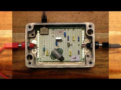 A 100 Mhz crystal oscillator used as carrier for programming a quartz ...