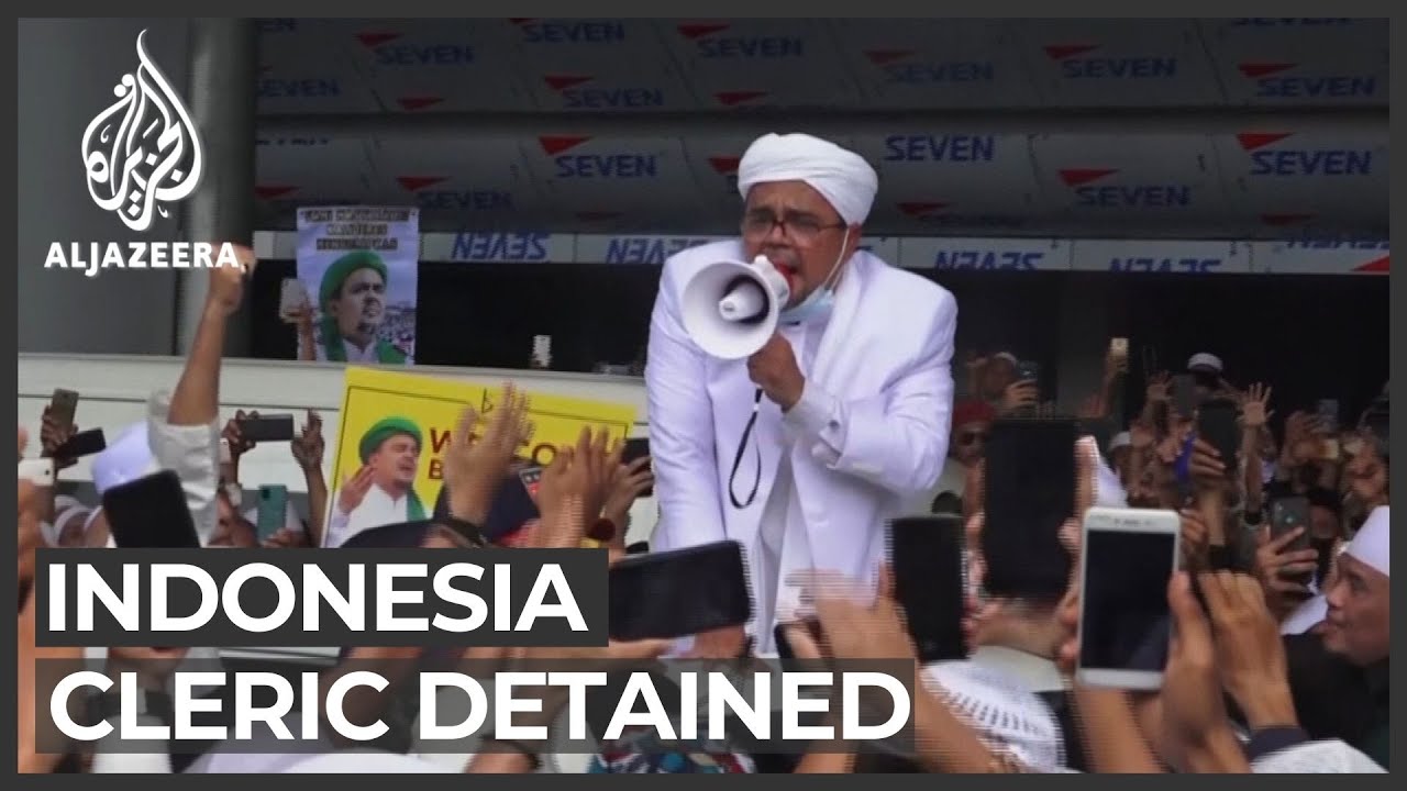 Indonesian Muslim leader turns himself in over COVID rule breach