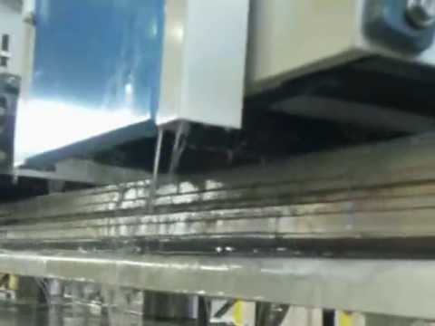 Machine for  the grind finishing of sheets and profiles.