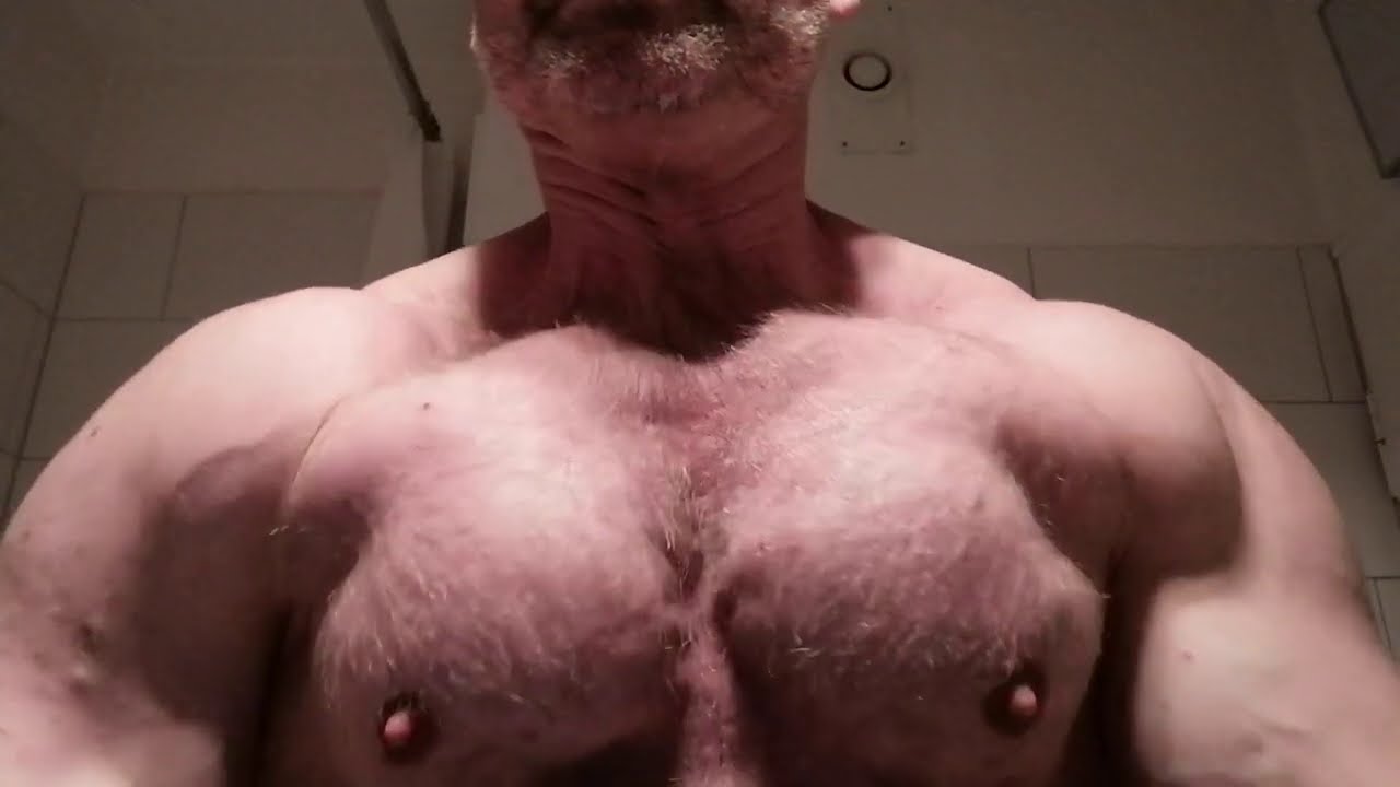 Muscle Dad flexing