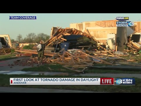 As the sun rises, residents assess damage