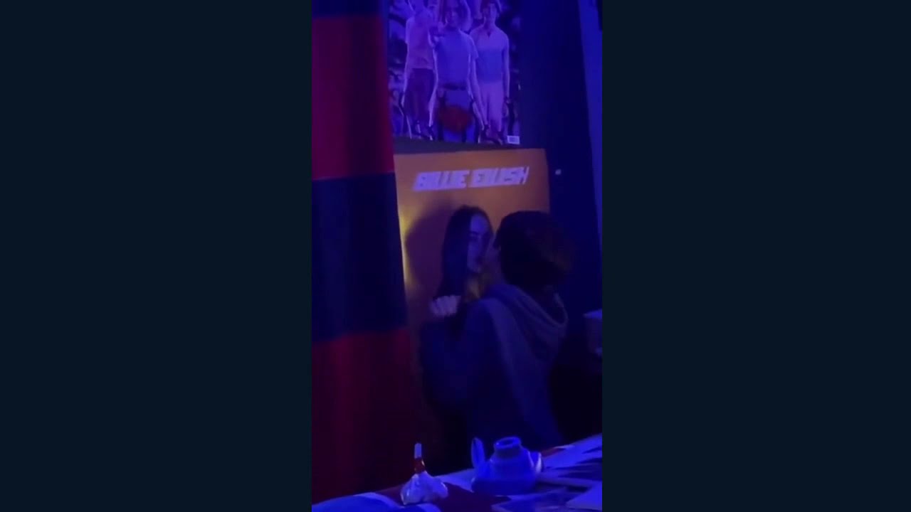 Little kid kisses Billie Eilish's poster