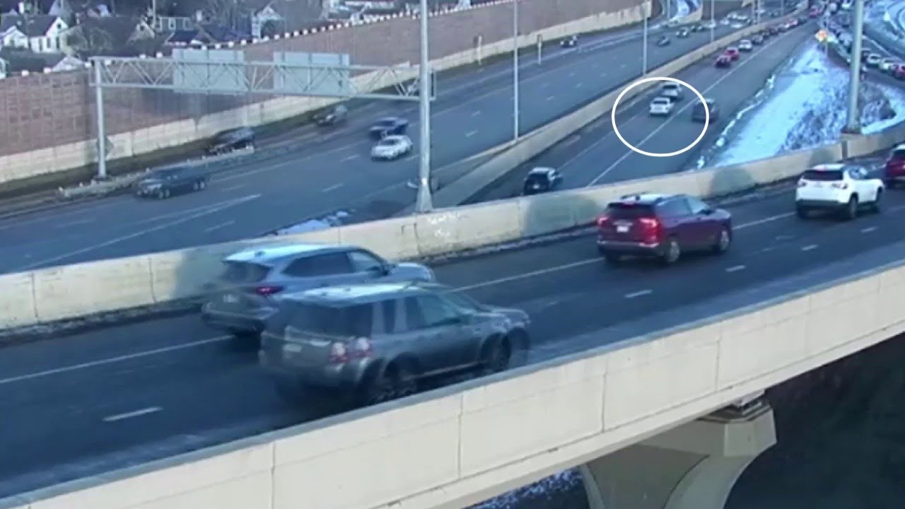 VIDEO: ICE agent points gun at another driver