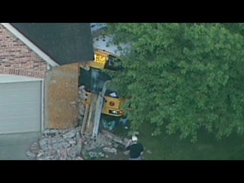 School bus driver not wearing his seat belt crashes into home