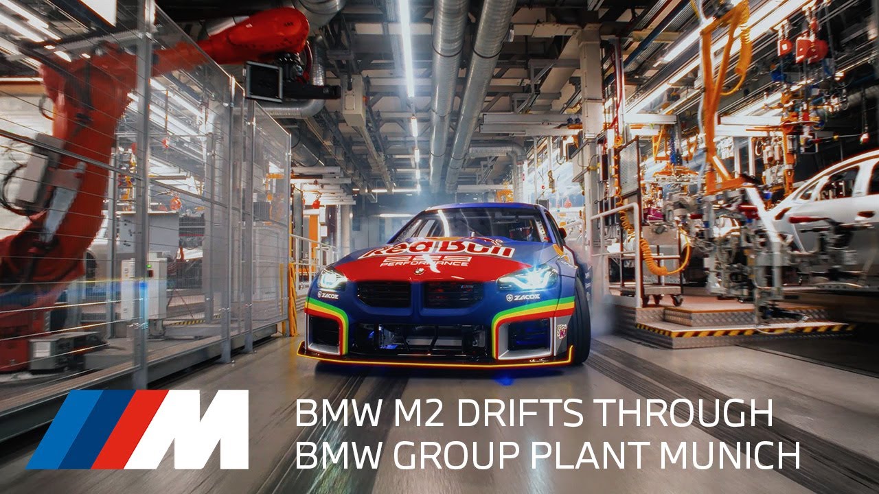BMW M2 drifts through the BMW Group Plant Munich. Red Bull Germany x BMW M.