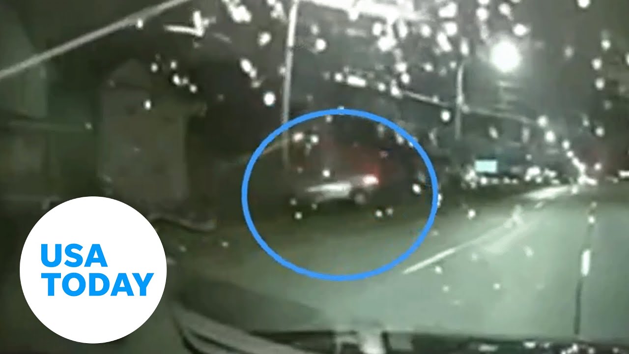 Police dashcam captures drunk driver going airborne on Michigan street | USA TODAY