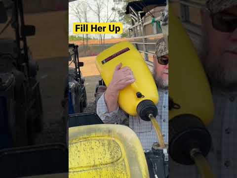 Filling up the JohnDeere 3025e.