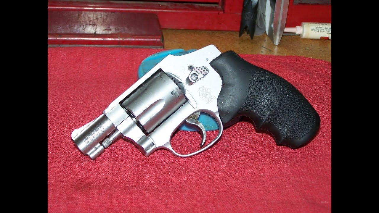 How do you get the hand & hand spring back on your Smith & Wesson Revolver.