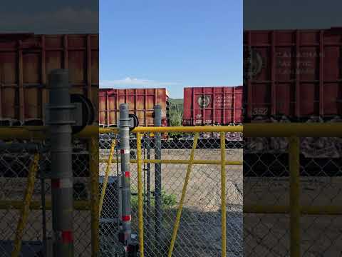 CPKC Train in Calgary. KCS ES44AC Grey Royal Canadian Pacific SD70ACU,and KCS SD70ACE