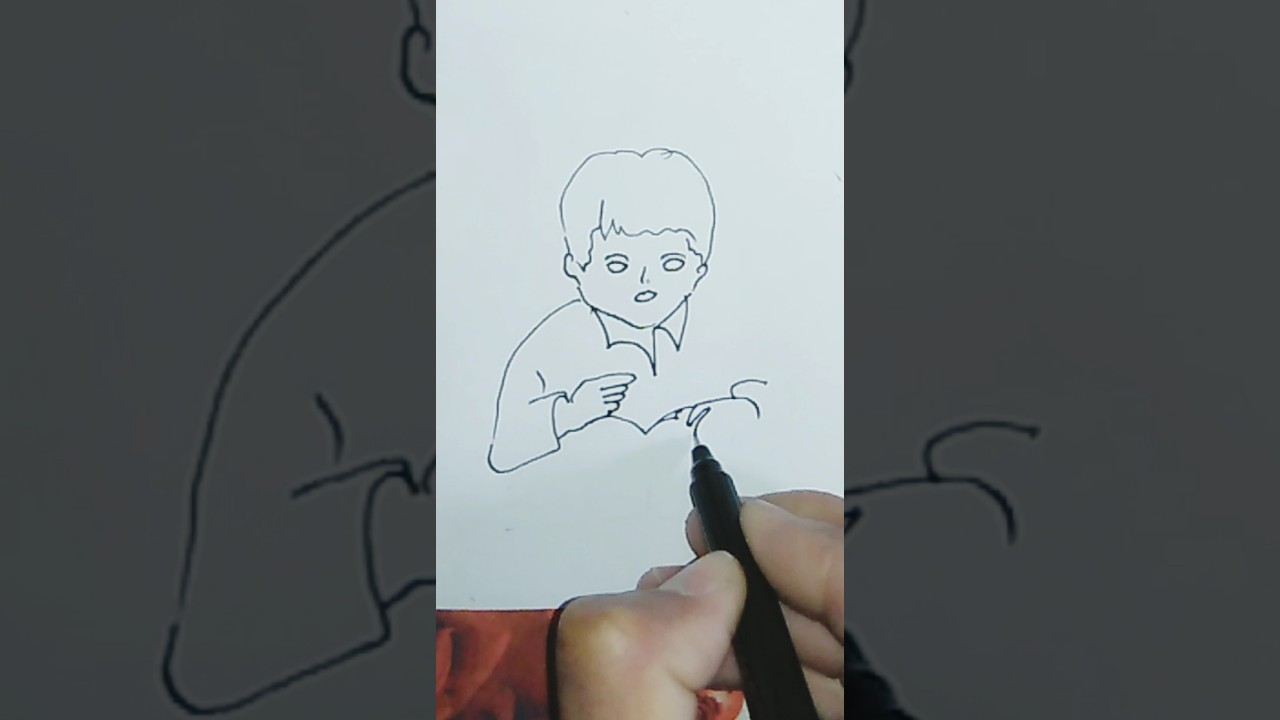 a boy reading a book.