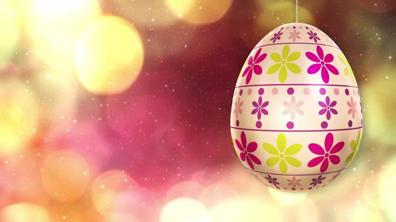 Rotating Easter Egg On Bokeh Background Stock Motion Graphics