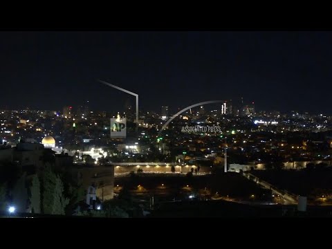 Interceptions light up night sky over Jerusalem as Iranian and Israeli strikes continue