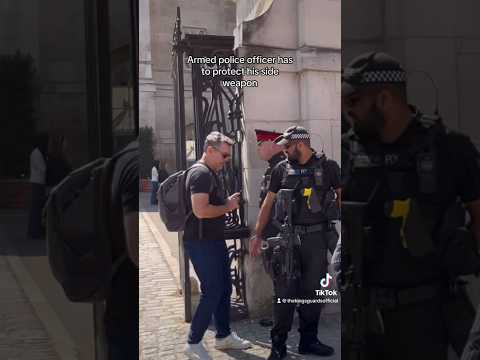 Armed police officer has to protect his side weapon! 😱