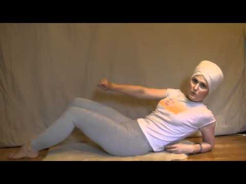 GuruPrem's wife, Simran Kaur teaching Stretch pose, correctly