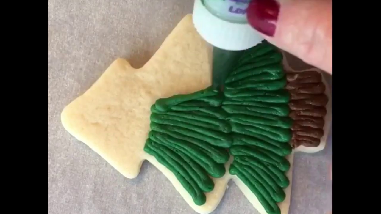 Christmas tree buttercream frosted cookie