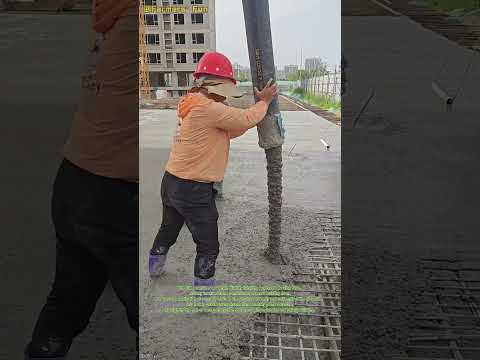 Precision in Construction: A Woman Pouring Concrete